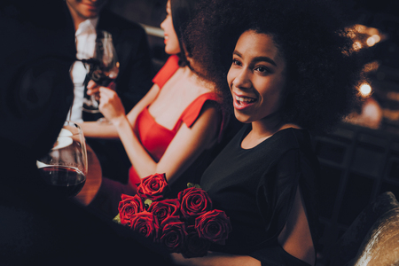 Friends in a Restaurant Enjoying Romantic Evening. Group Happy Friends ...