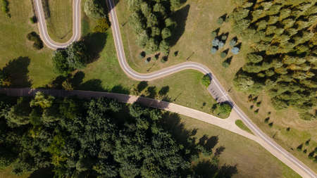 A winding bike path in the park. Winds among trees and bushes. Aerial ...
