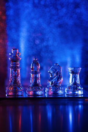 Transparent glass chess pieces. King, Bishop, Knight and Rook on ...