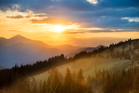 Beautiful dramatic sunset in the mountains. Landscape with sun shining ...