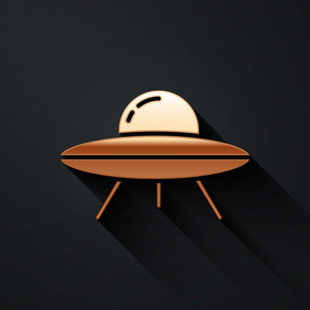 Gold UFO flying spaceship icon isolated on black background. Flying ...