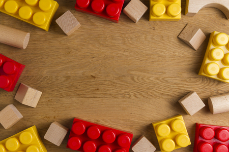Colorful construction blocks and cubes on wooden background as toys ...