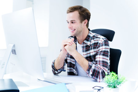 Happy man sitting with computer at office Images - Search Images on ...