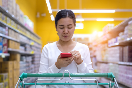 woman holding smartphone use application check rewards point for ...