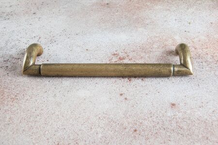 Vintage Large bronze door hendle on concrete background. Copy space for ...