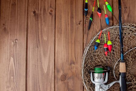 Fishing tackle - fishing rod fishing float and lures on beautiful blue ...