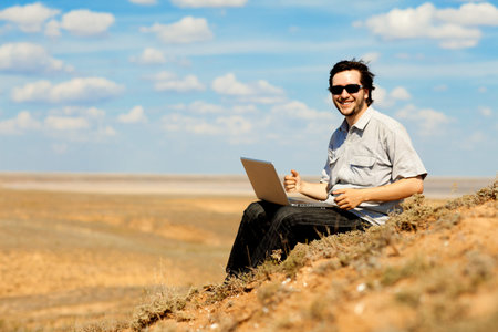 happy man with laptop on the hill - Stock Image - Everypixel