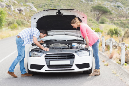 Couple after a car breakdown at the side of the road - Stock Image ...