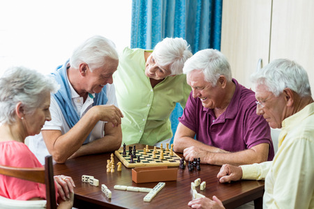 Seniors playing games in a retirement home - Stock Image - Everypixel