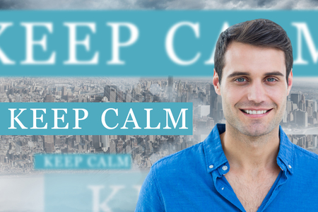 The word keep calm and handsome man smiling to the camera against room ...