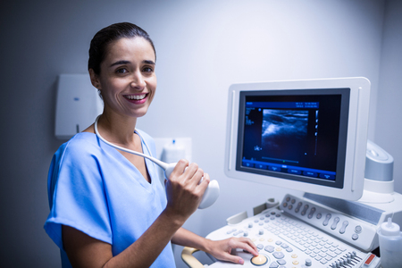 Nurse using ultrasonic device in hospital - Stock Image - Everypixel