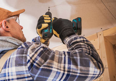 Caucasian Construction Contractor Assembling Drywall Board Using ...