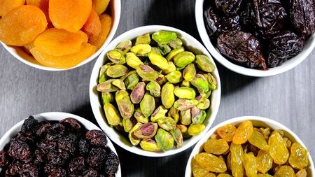 Selection of Healthy Fruit and Nut Snacks in White Bowls Looking Down ...