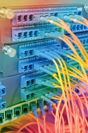 Panel of Fiber network switch with some yellow network cables - Stock ...