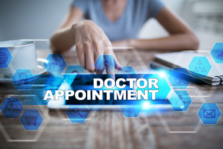 Woman using tablet pc, pressing on virtual screen and selecting doctor ...