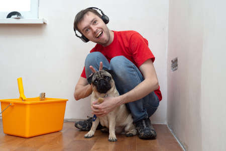 Repair man have funny with pet pug dog in new house during renovation ...