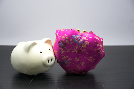piggy bank and pink heart is isolated ,with hand safe coin for piggy ...