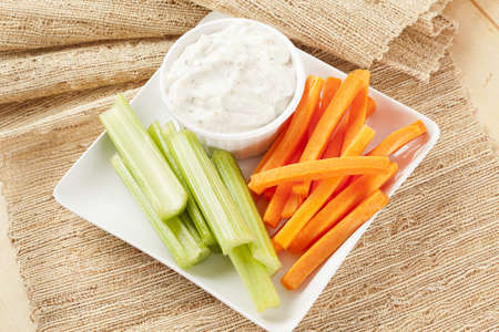 Ranch dressing with fresh carrots and celery - Stock Image - Everypixel