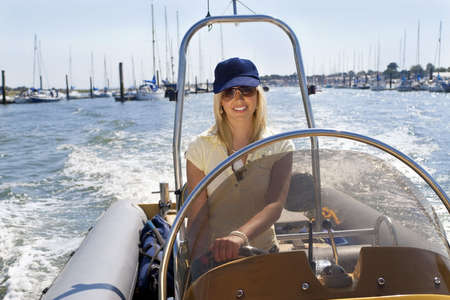 Woman driving boat Images - Search Images on Everypixel