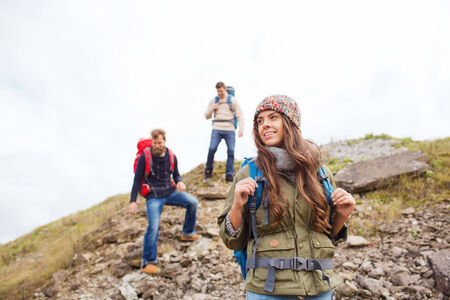 adventure, travel, tourism, hike and people concept - group of smiling ...