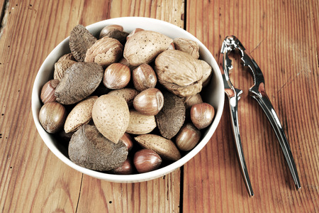 brazil nuts, walnuts, almonds and hazelnuts in ceramic bowl - Stock ...