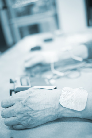 Patient hand, wrist and arm in electro physiotherapy electrical impulse ...