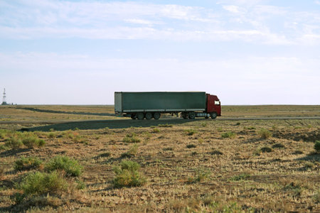 Lone van driving through the steppe road. - Stock Image - Everypixel