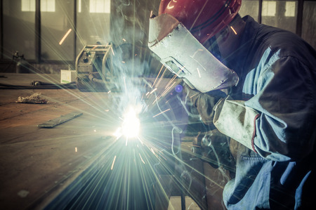 Welding work issued strong dazzling rays of light - Stock Image ...