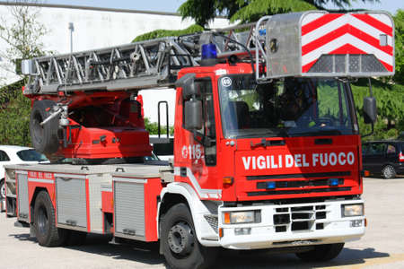 truck with ladder of the fire brigade arrives in speed at the place of ...