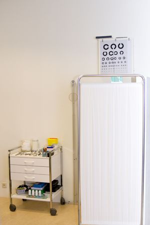 eye tester and medical equipment in examination room of doctor - Stock ...