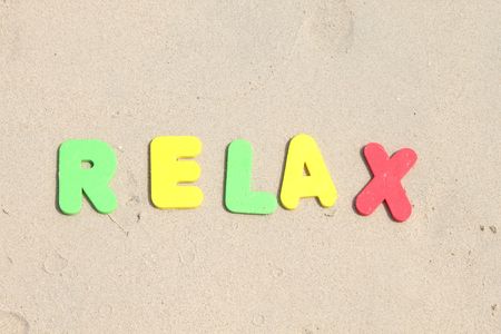 Relax text written with plastics letters colours. - Stock Image ...