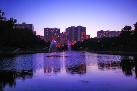 night town scene river, trees and sky - Stock Image - Everypixel