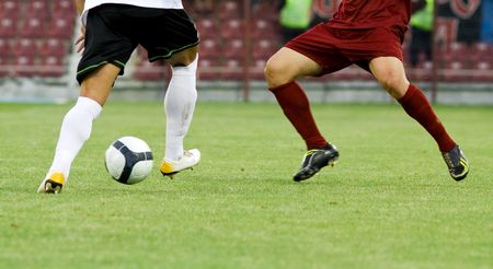 Soccer players running after the ball - Stock Image - Everypixel
