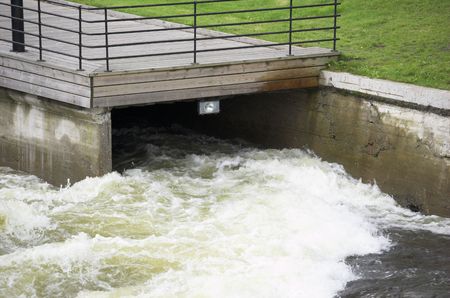 A foaming stream of Water at Akerselva river pipe intake in Oslo ...