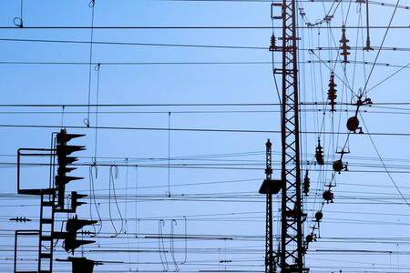 Red railway electric signal light and electric overhead contact wire ...