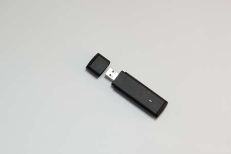 A black USB internet stick on a white backround - Stock Image - Everypixel