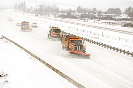Snow plows clearing the freeway on Interstate 5 during a winter snow ...