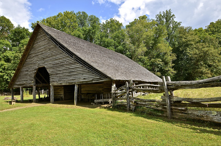 An old weathered barn rests on support posts with open sides - Stock ...