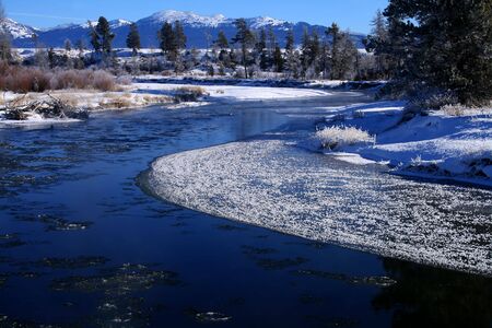 Payette river with ice flowing on sub-zero morning in central Idaho ...
