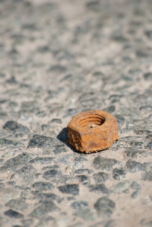 rusty Hex nut on the pavement, brightly lit, macro - Stock Image ...