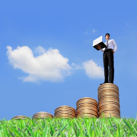 Successful business man working on growth money stairs coin with sky ...