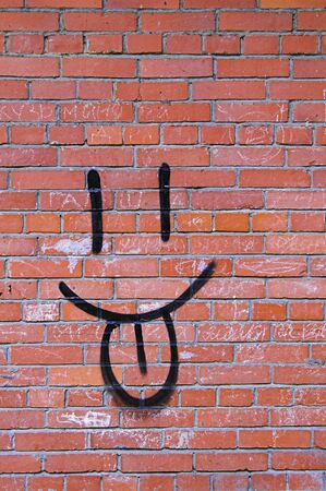 Brick Wall and Smile Graffiti - 2 - Smile Graffiti on a Red Brick Wall ...
