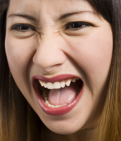 Face of a screaming pretty woman. Close up. - Stock Image - Everypixel