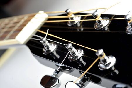 Details of acoustic black guitar. neck, nut, frets, strings. - Stock ...