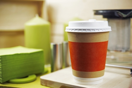 Plastic One Time Use Coffee Cup on the Kitchen Table. Food and Drink ...